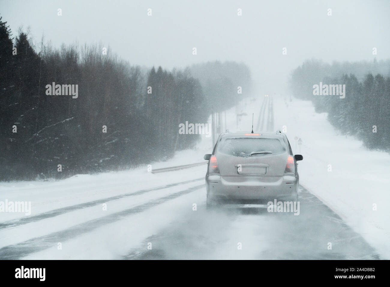 he car is driving on a winter road in a blizzard Stock Photo - Alamy