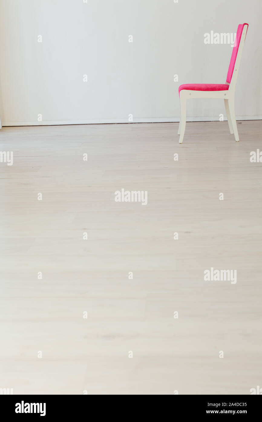 pink chair stands alone in the white room Stock Photo - Alamy