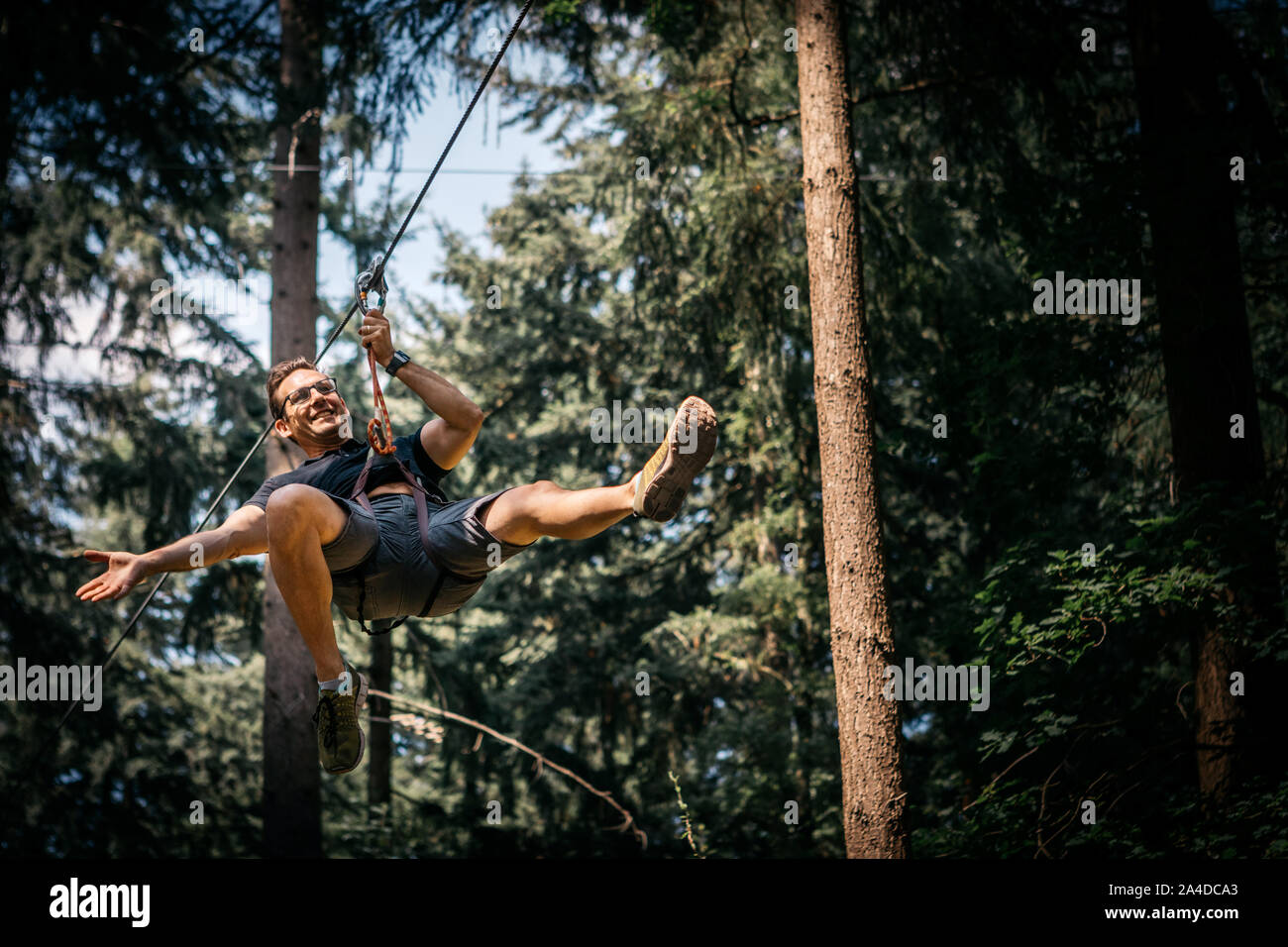 Adult zip line hi-res stock photography and images - Alamy