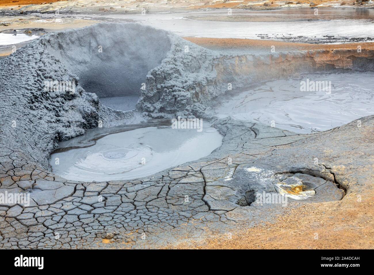 PONDS OF BOILING GRAY MUD AND FUMAROLES GIVING OFF SULFURIC GAS ...