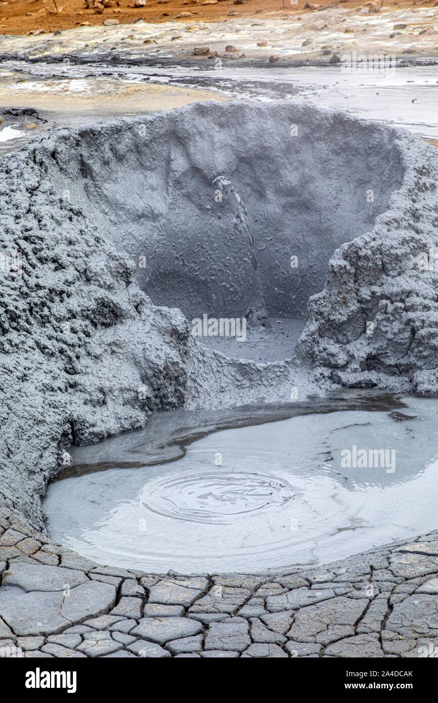 PONDS OF BOILING GRAY MUD AND FUMAROLES GIVING OFF SULFURIC GAS ...