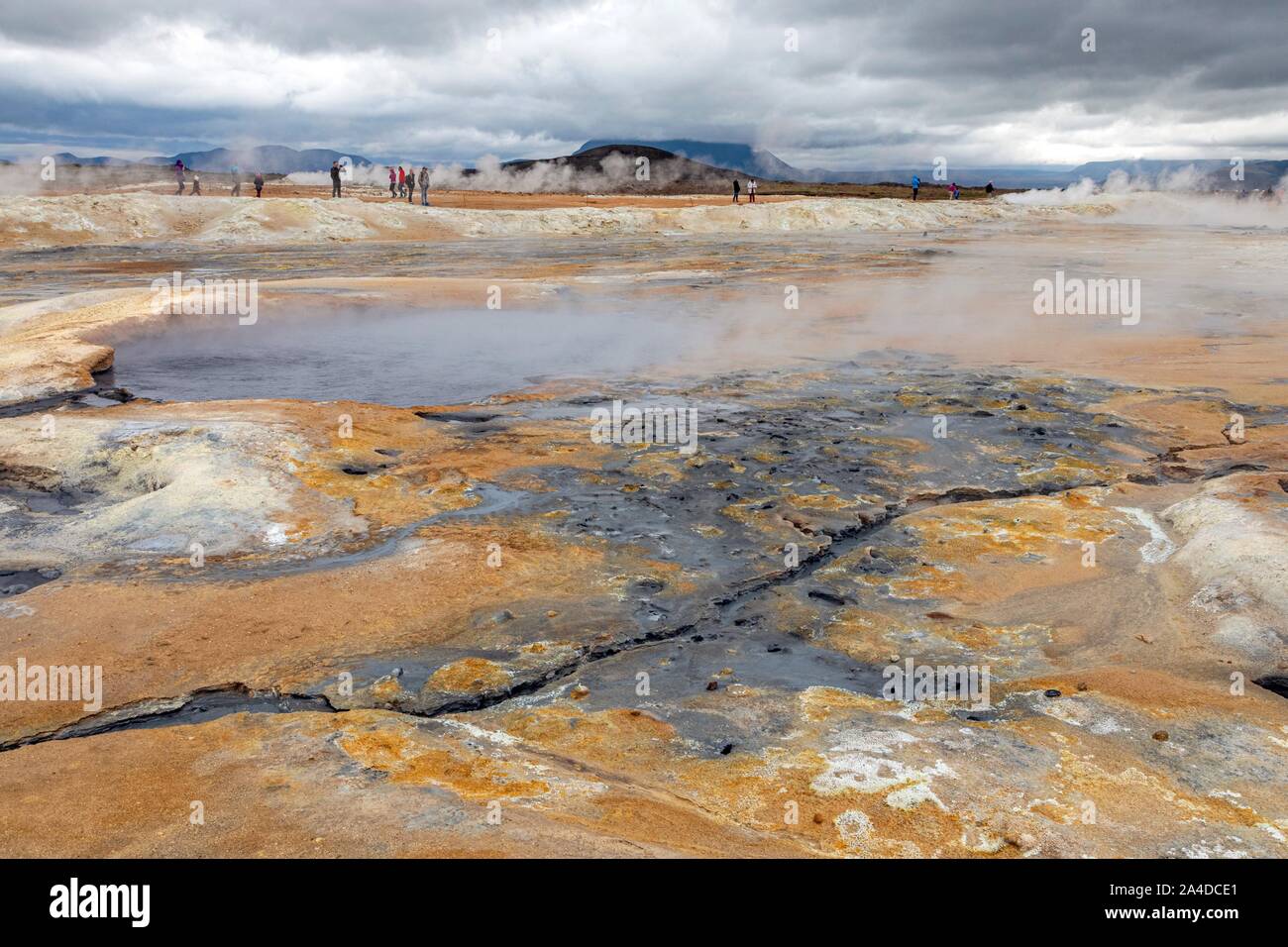 PONDS OF BOILING GRAY MUD AND FUMAROLES GIVING OFF SULFURIC GAS ...