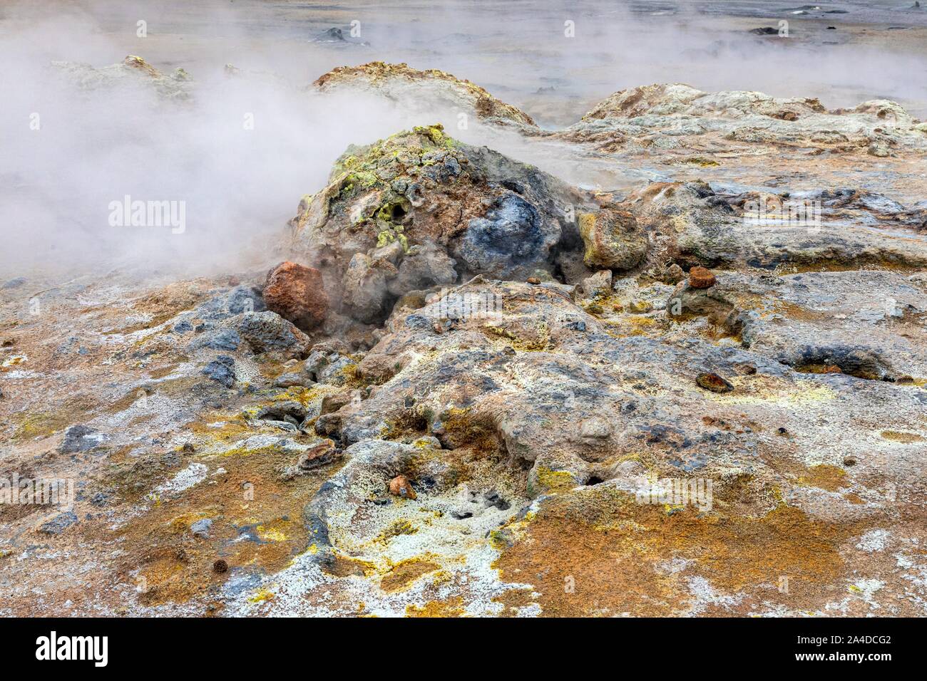 PONDS OF BOILING GRAY MUD AND FUMAROLES GIVING OFF SULFURIC GAS ...