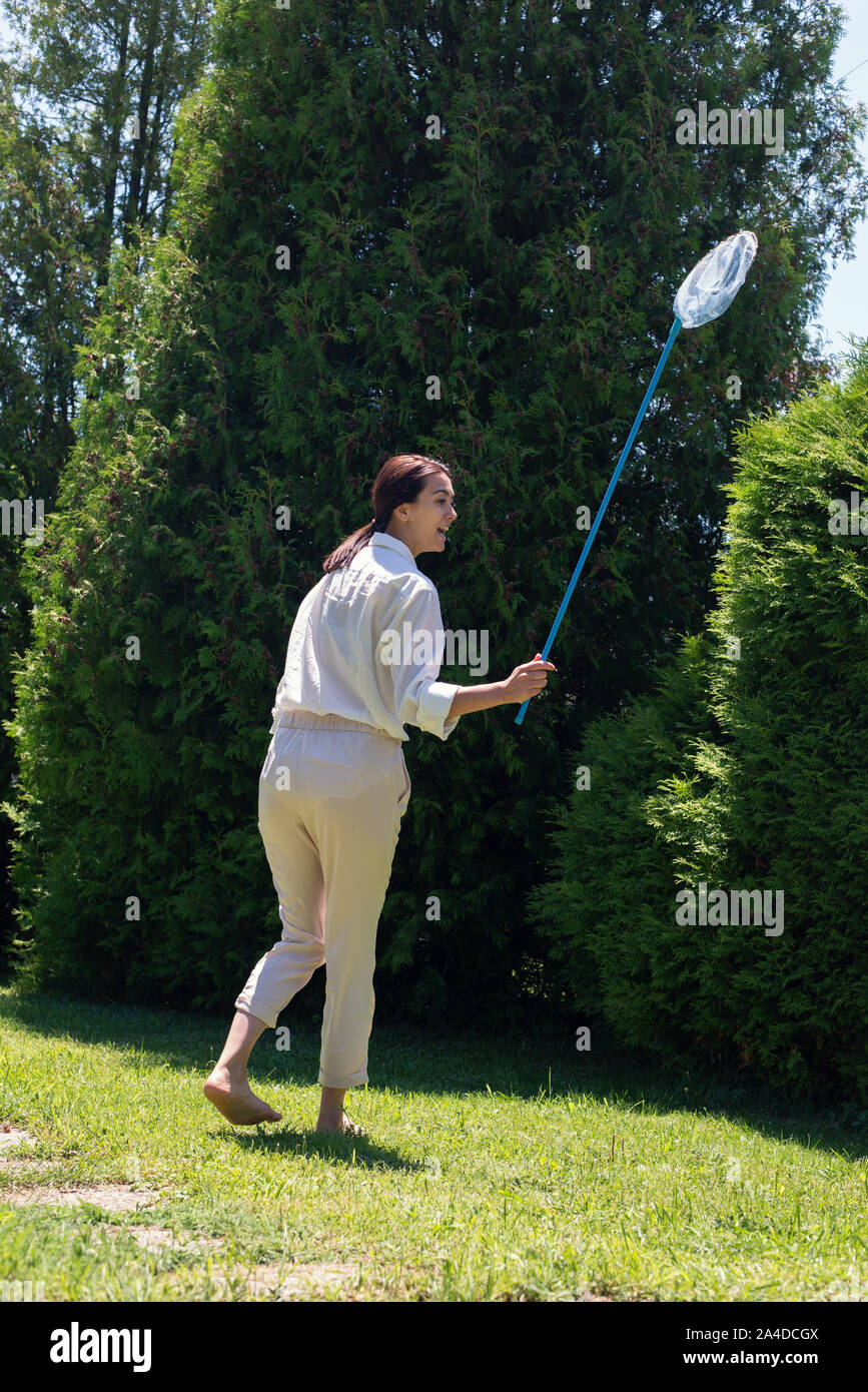 Woman butterfly net hi-res stock photography and images - Alamy