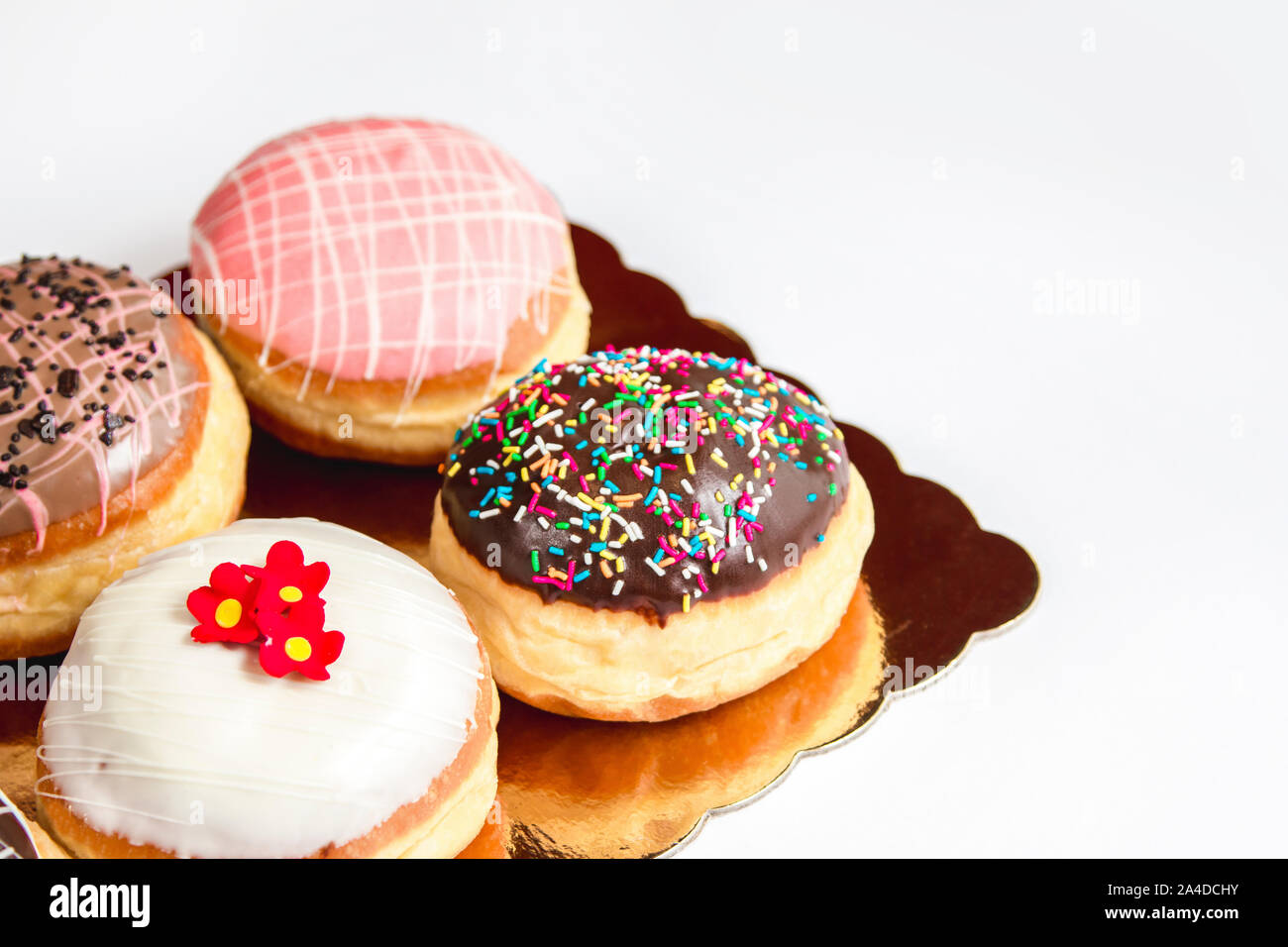 Group of colorful doughnuts on a white background Stock Photo - Alamy