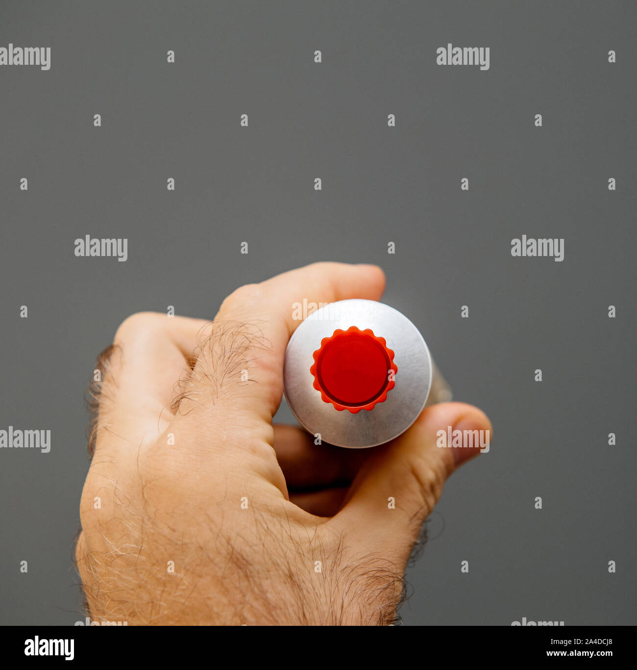 Man hand holding mayonnaise mustard tube with red cap Stock Photo - Alamy