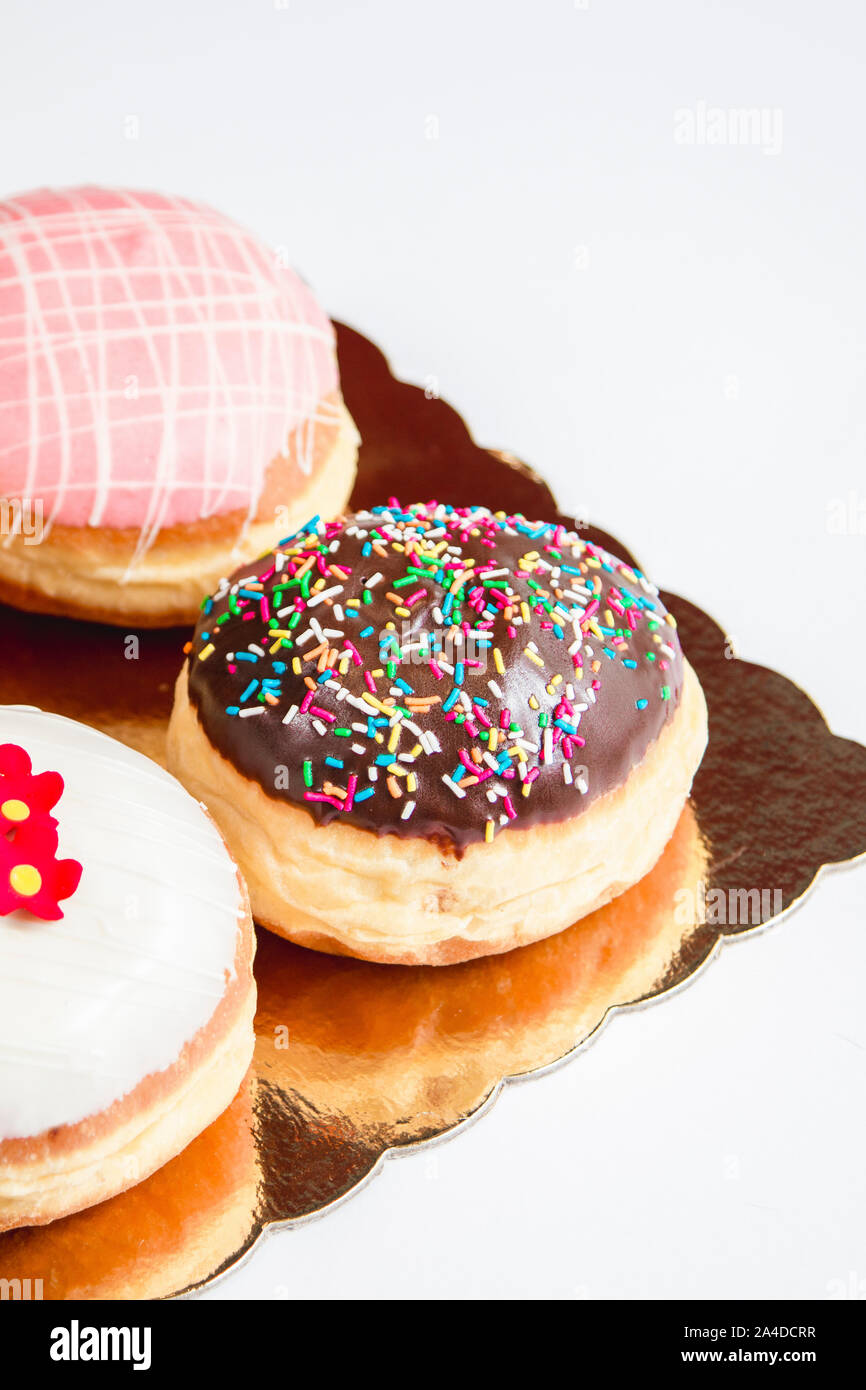 Group of colorful doughnuts on a white background Stock Photo - Alamy