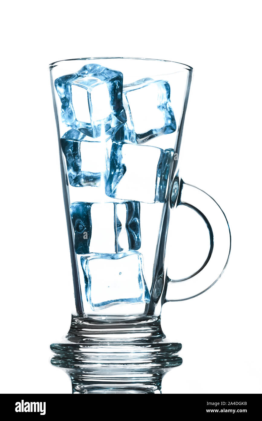 Glass with ice cubes. Isolated on white Stock Photo - Alamy