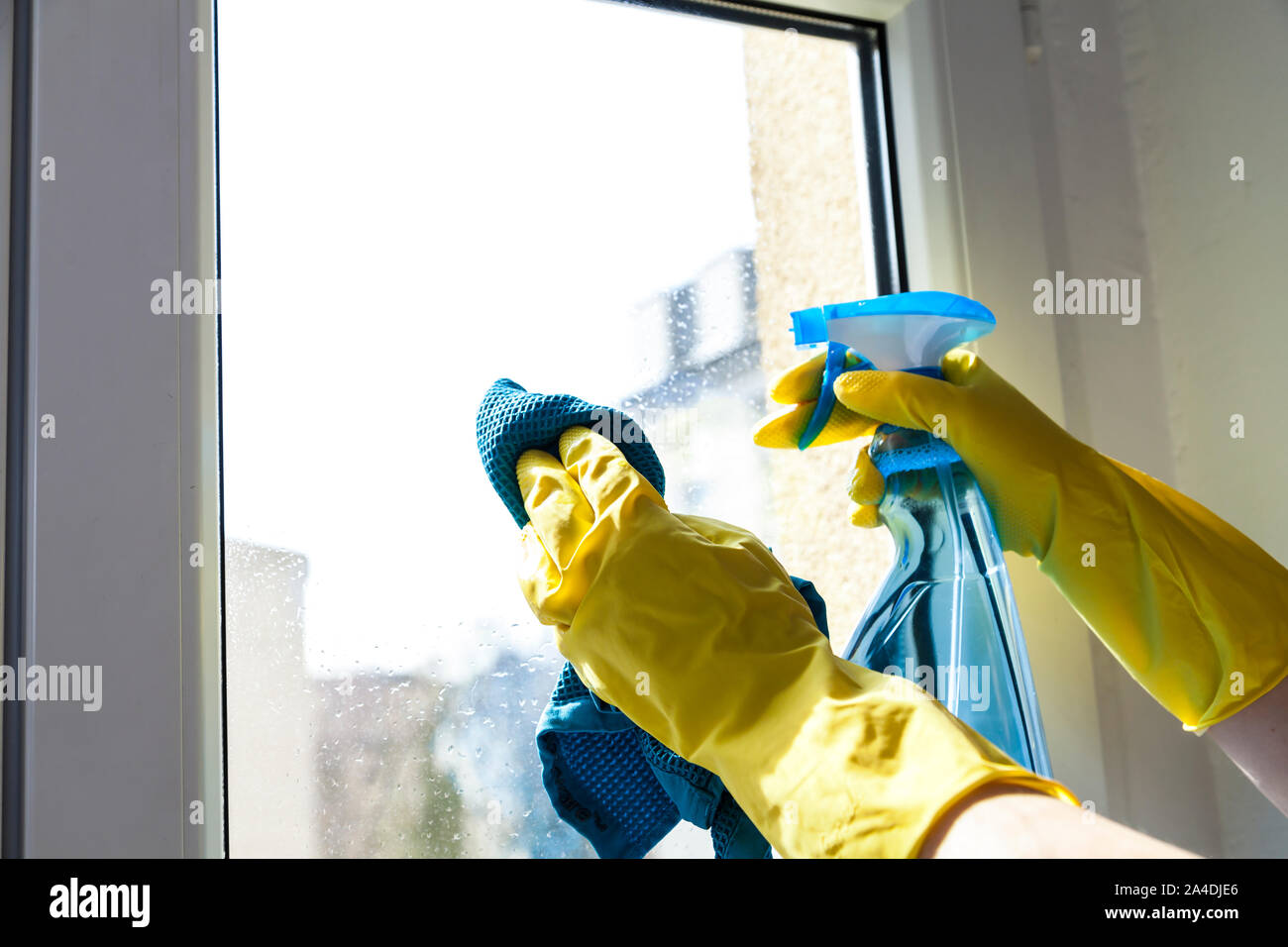 Cleaning window in spring time Stock Photo - Alamy