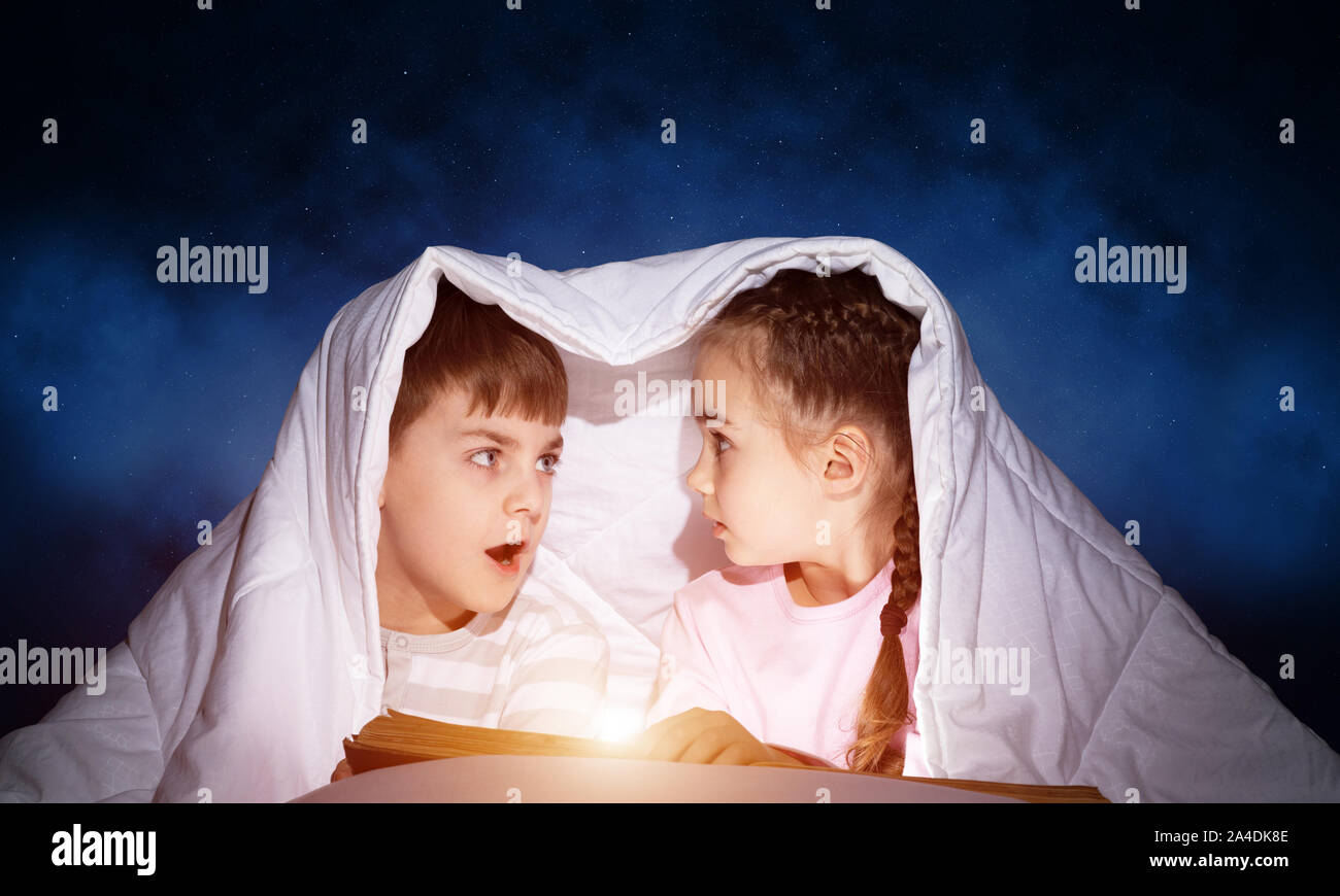 Scared little girl and boy looking at each other Stock Photo - Alamy