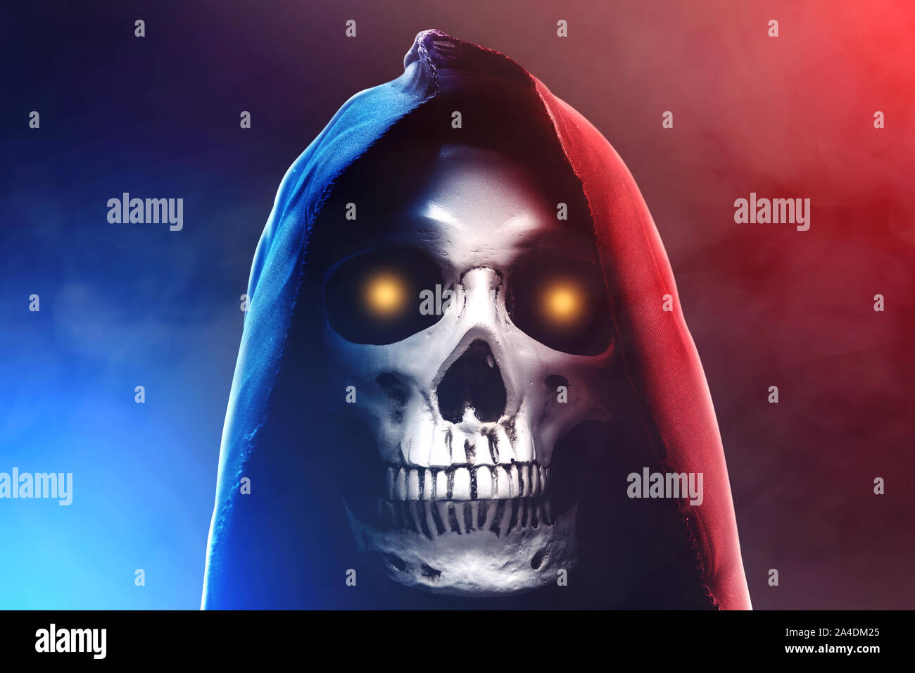 Human skull with a black cloak over a dark smoke background Stock Photo ...