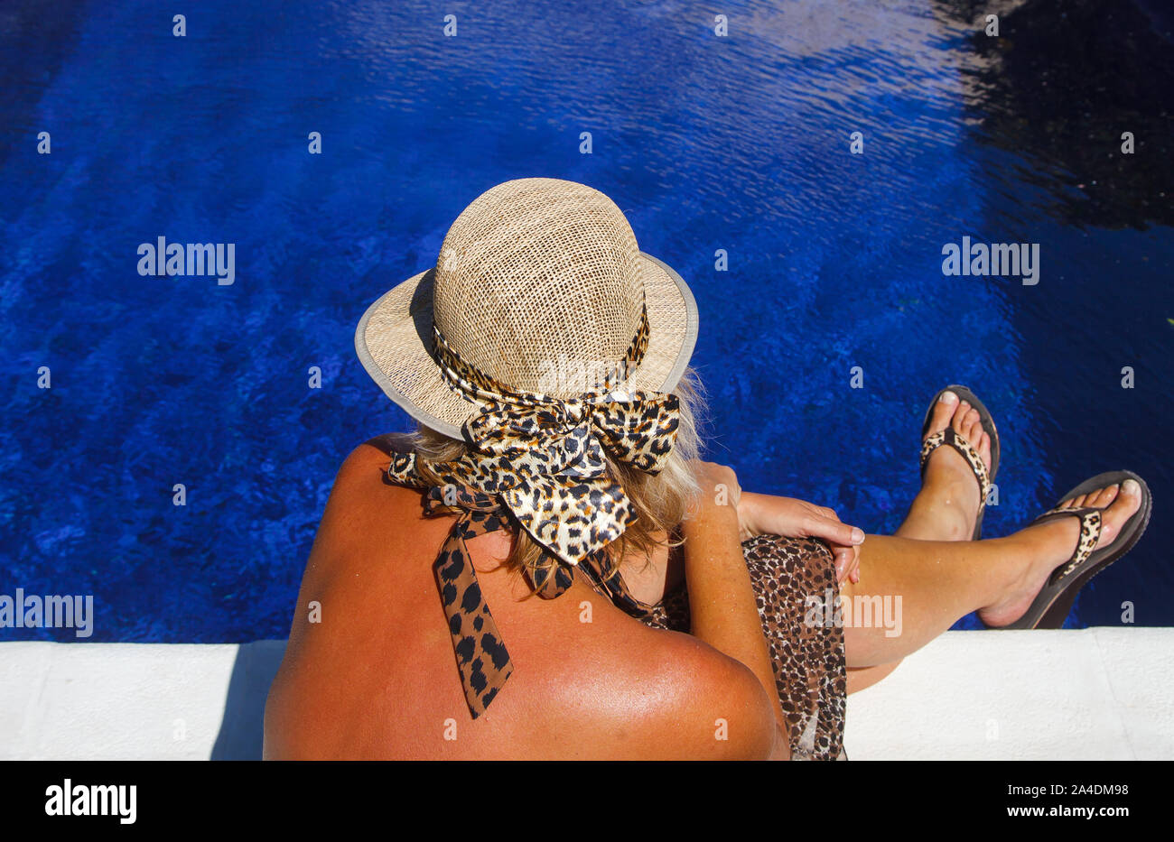 Woman sitting in swimming pool hi-res stock photography and images - Alamy