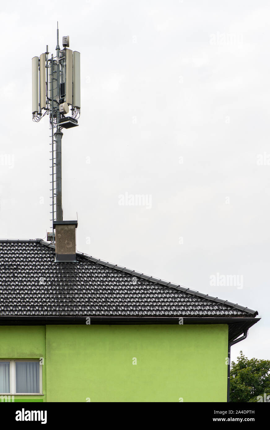 5G antennas on top of house. Antennas and transmitters on roof. High ...