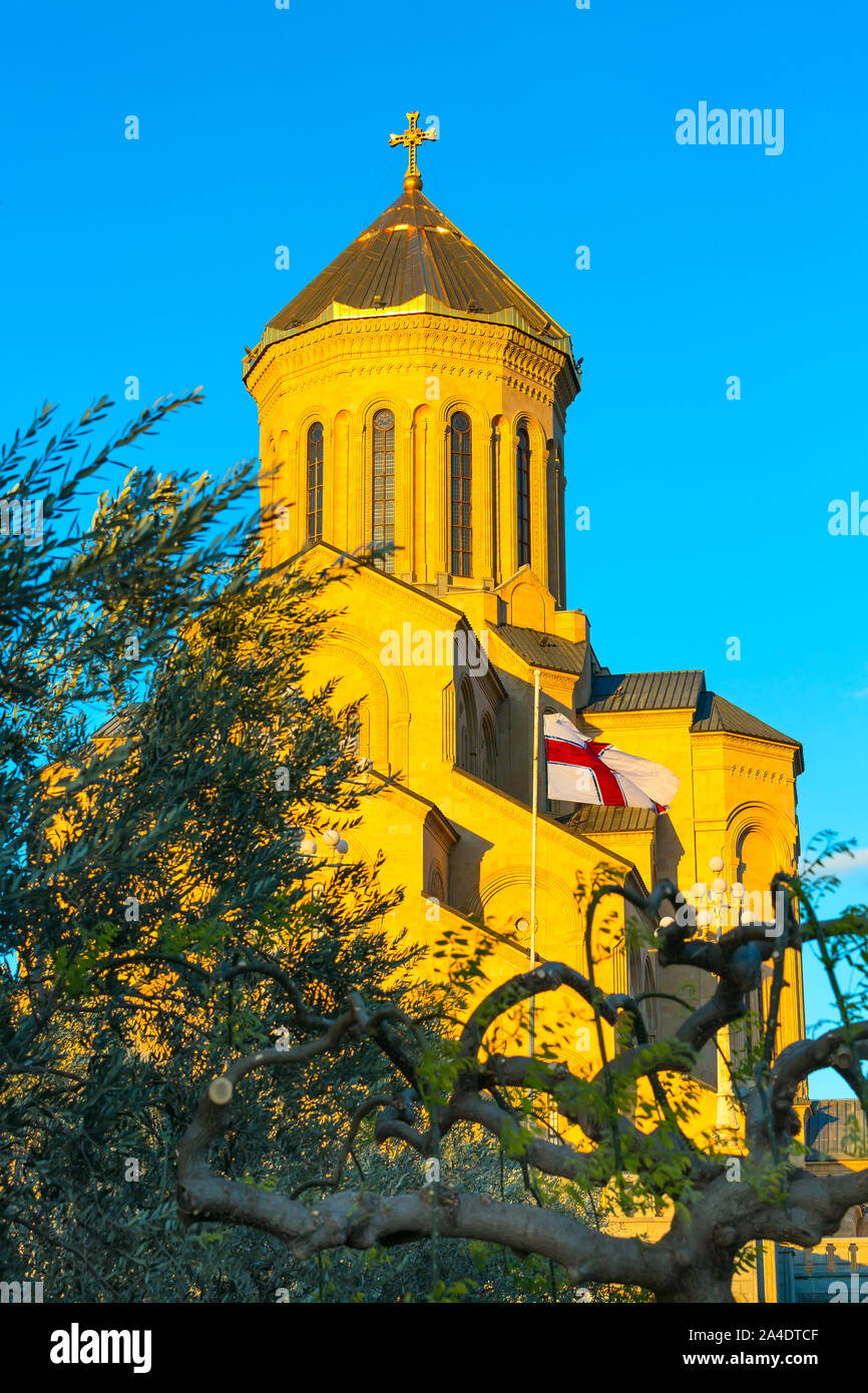Holy Trinity church or Tsminda Sameba Cathedral closeup sunset vertical ...