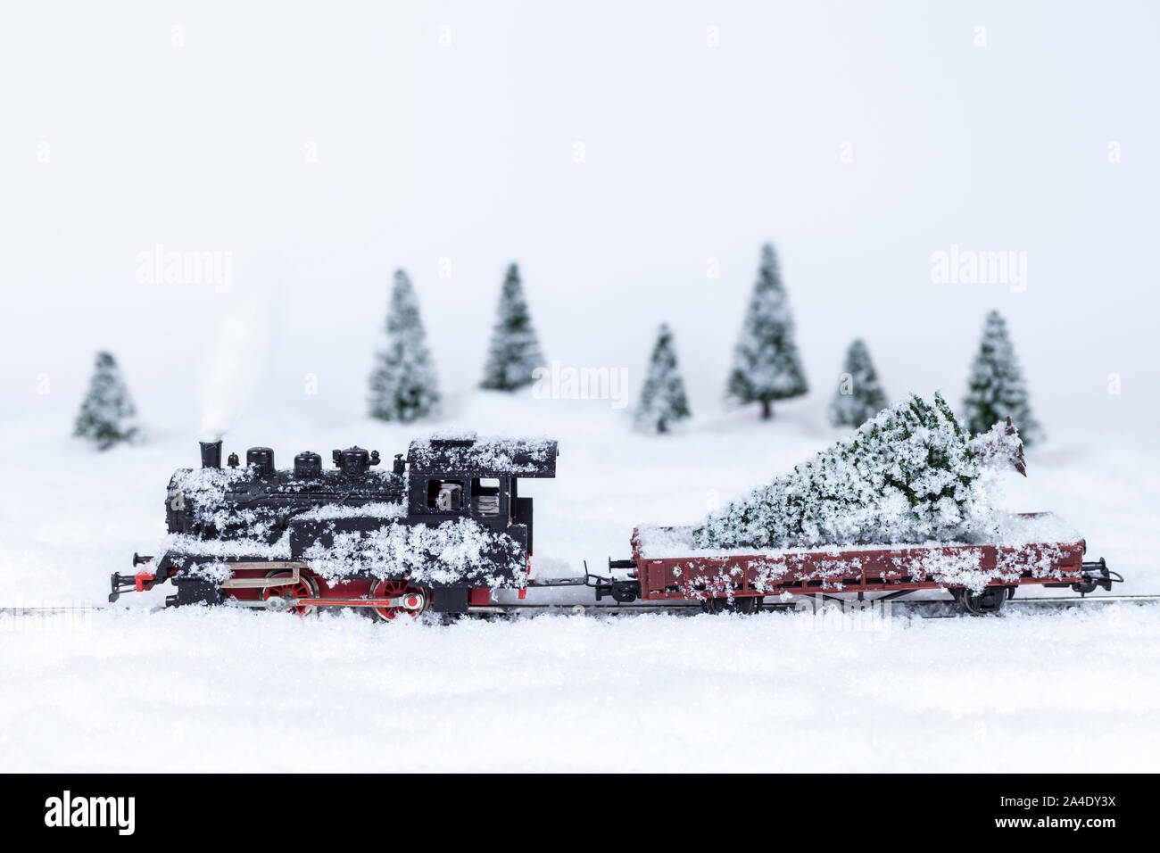 Christmas train in snowy landscape Stock Photo - Alamy