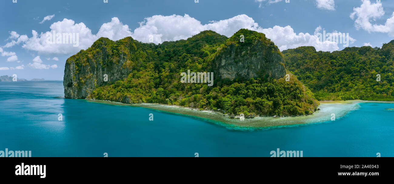 Aerial panoramic drone view of uninhabited tropical island with ...