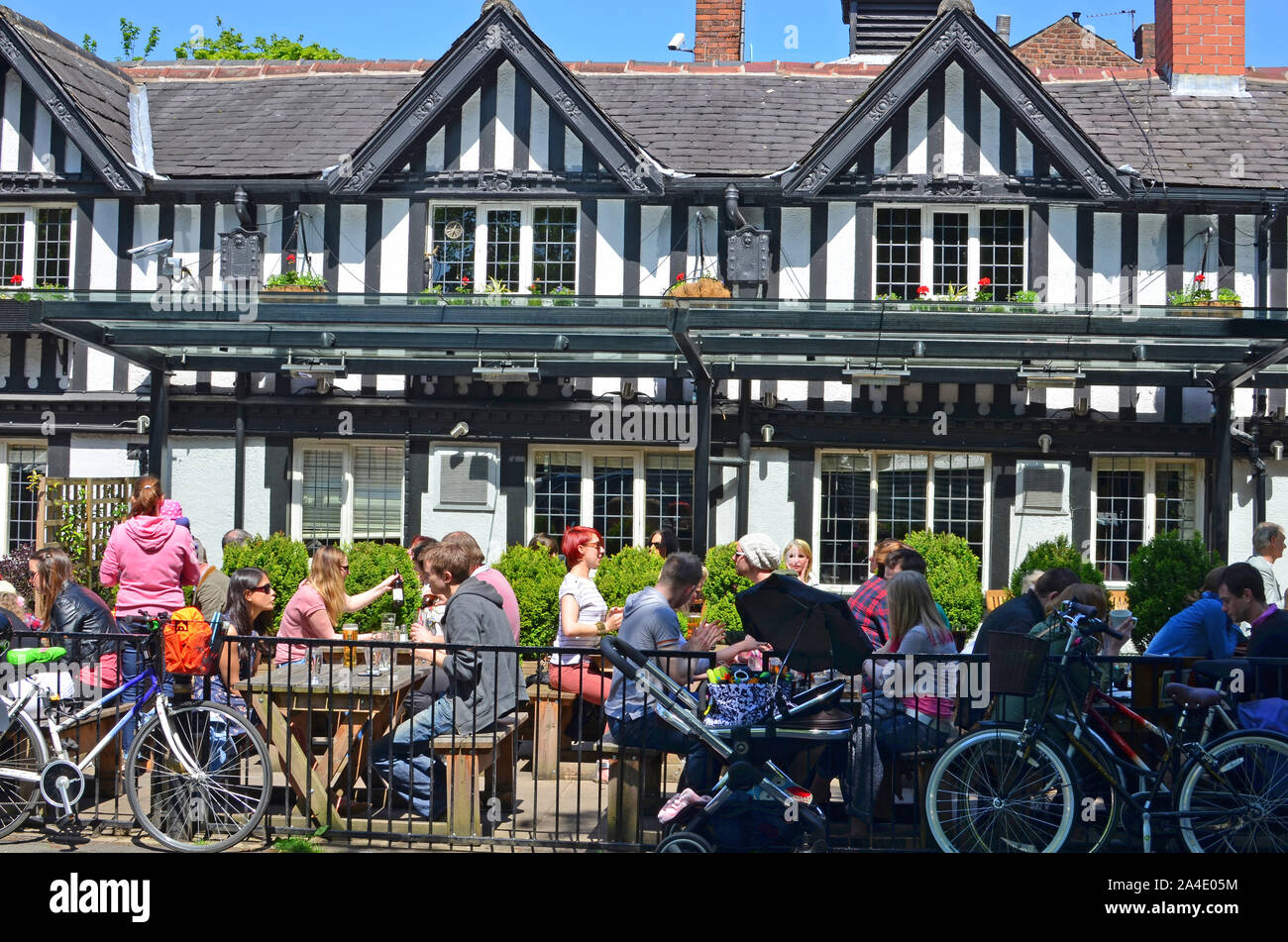 People sitting outside pub Stock Photo - Alamy