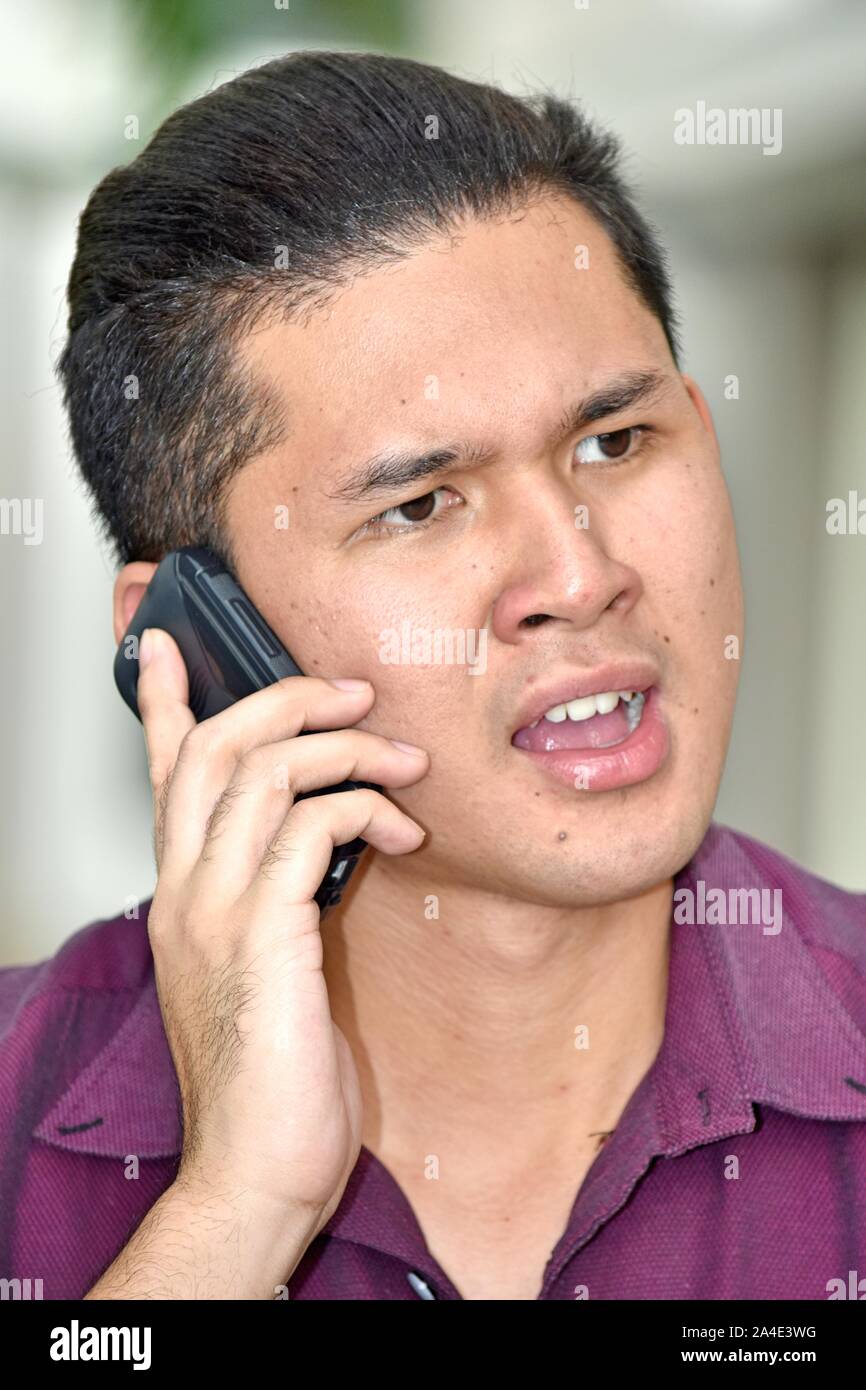 Man Using Cell Phone And Unhappy Stock Photo - Alamy