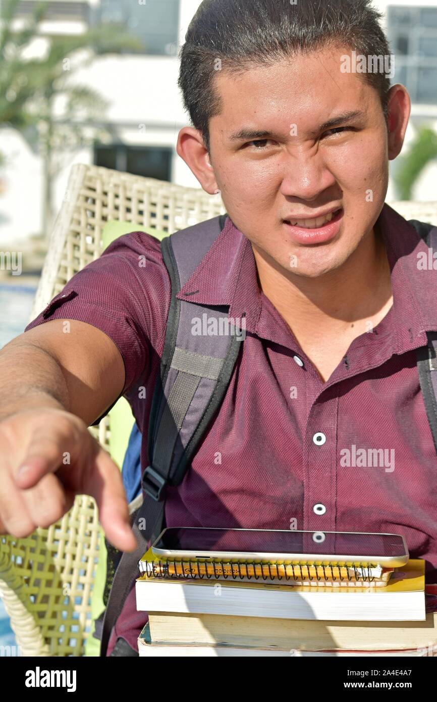 An Upset Young Filipino Male Student Stock Photo - Alamy