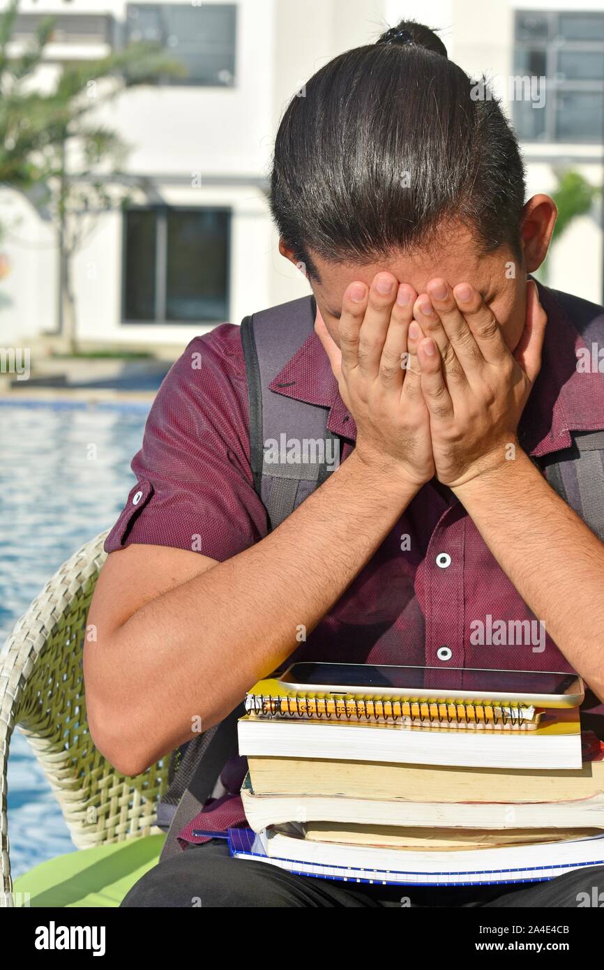 Male Student And Disappointment With Books Stock Photo - Alamy
