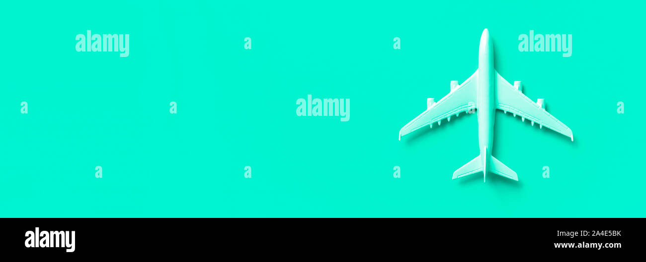 White plane, airplane in trendy green and turquoise color. Rainbow ...