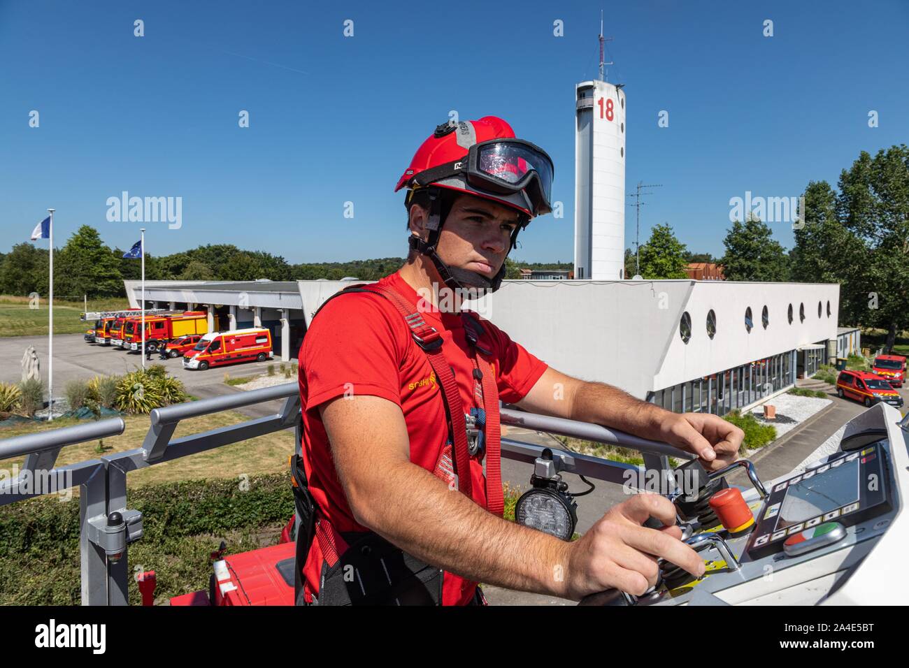 LADDER DRIVER IN FRONT OF THE FIRE STATION, FIREFIGHTERS FROM THE ...