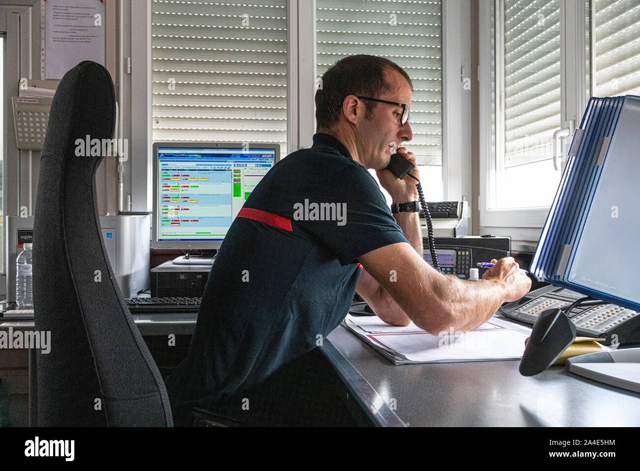 ON-DUTY TELEPHONE OPERATOR, FIREFIGHTERS FROM THE EMERGENCY RESCUE ...
