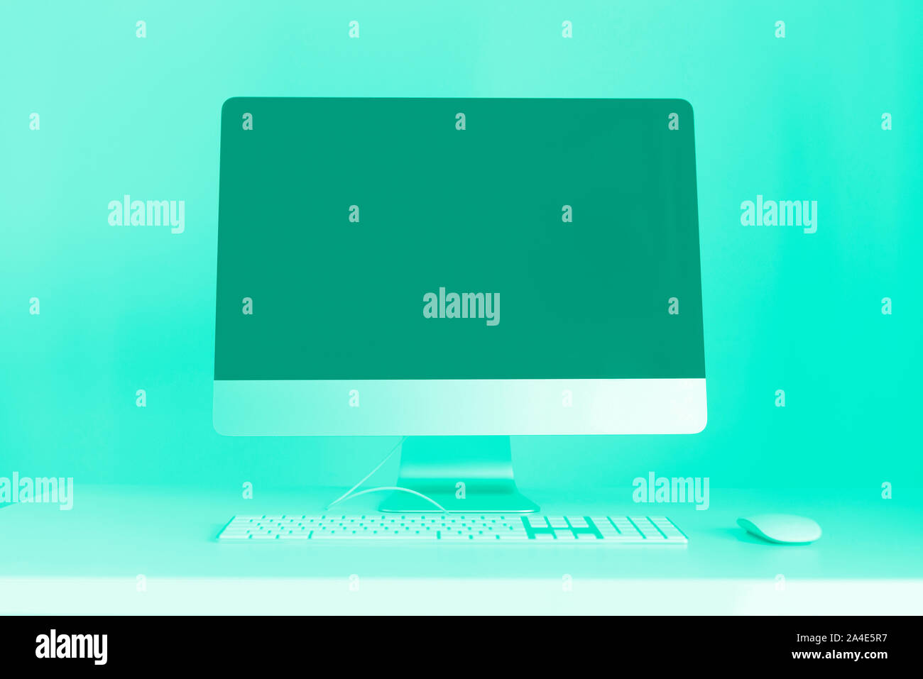 Keyboard, mouse, computer display with black blank screen. Trendy green ...