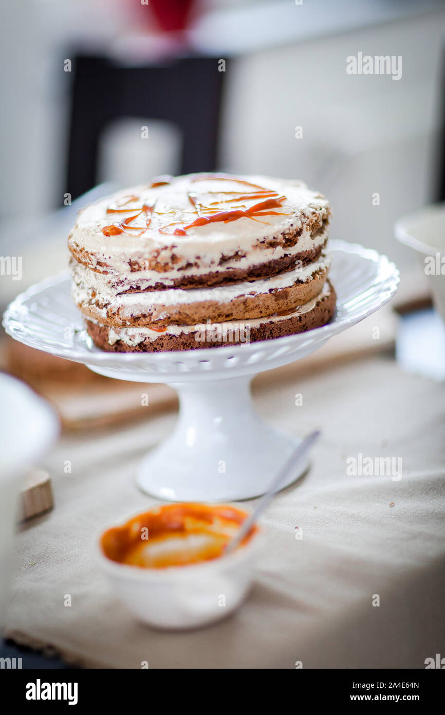 Creating a delicious multi-layered cake at home Stock Photo - Alamy