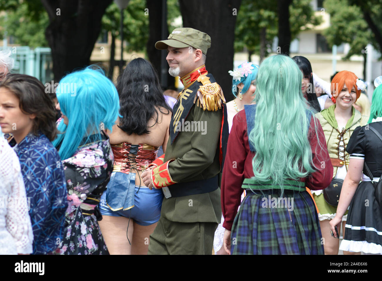 Cosplayer wearinga fantasy uniform walking though public park in in ...