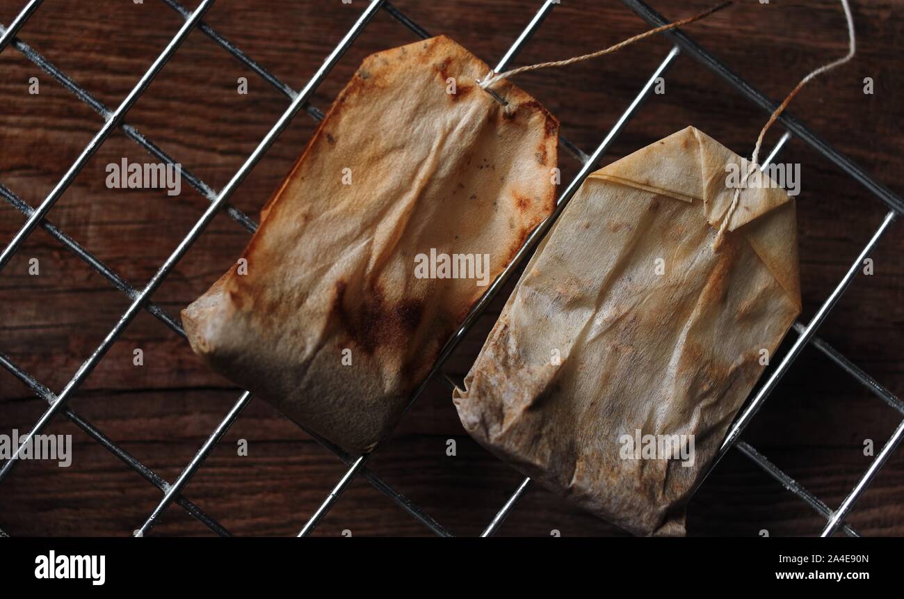 The old tea bag on the wooden floor Stock Photo - Alamy
