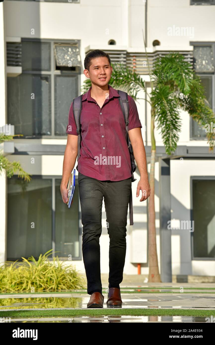 Happy Handsome Filipino Person Walking On Campus Stock Photo - Alamy