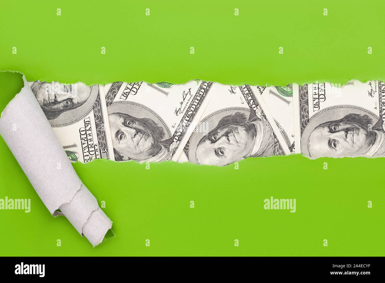 US dollar cash find through the torn green paper. Discovery, finding ...
