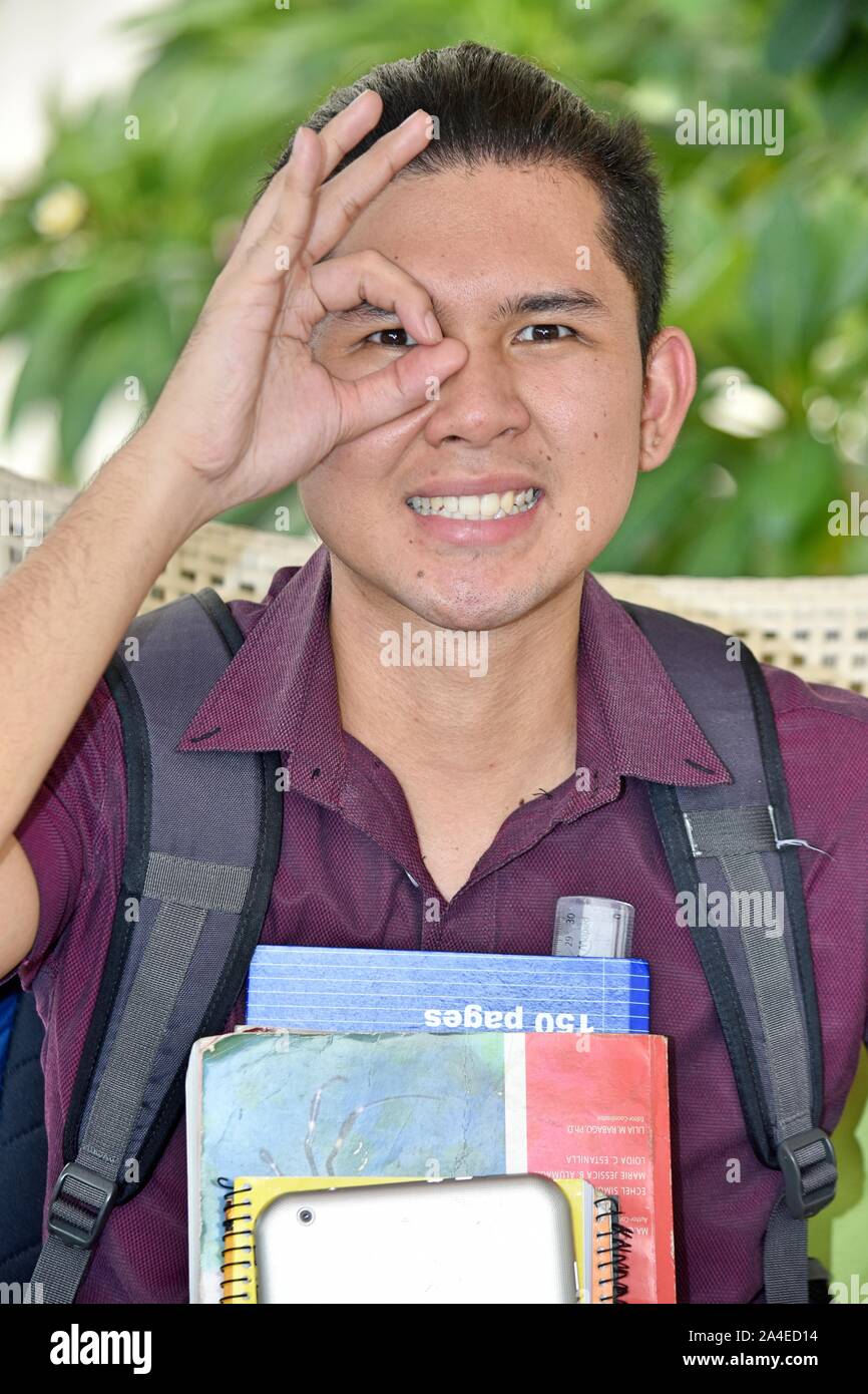 Handsome Filipino Boy Student Searching With Notebooks Stock Photo - Alamy