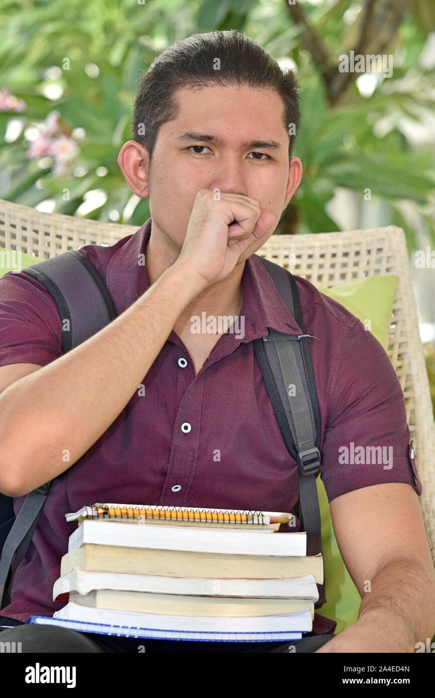 Minority Boy Student Coughing With Books Stock Photo - Alamy