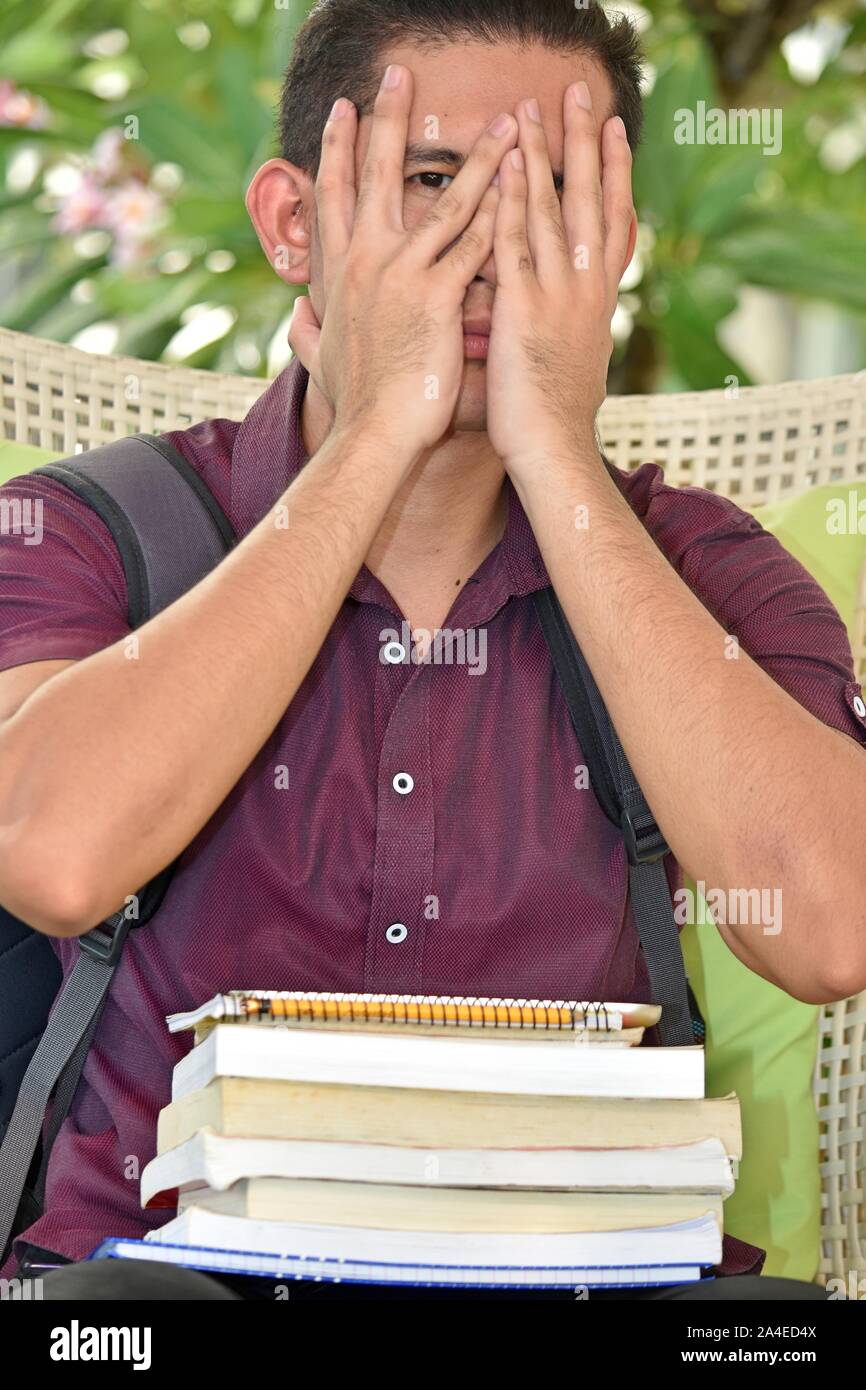 Scared male student books hi-res stock photography and images - Alamy