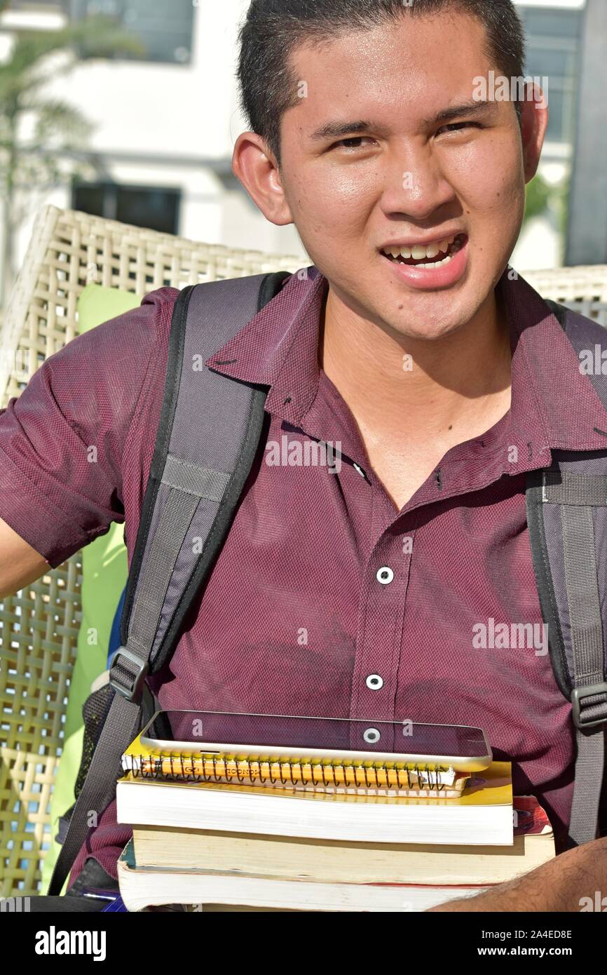University Asian Boy Student Portrait With Books Stock Photo - Alamy