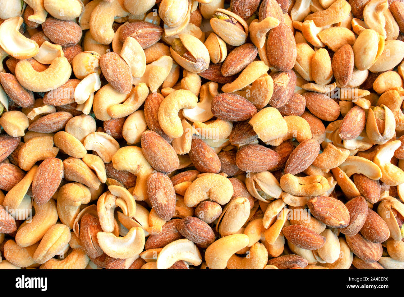 Background made of mixed nuts. Healthy snack and food. Salted and spicy ...