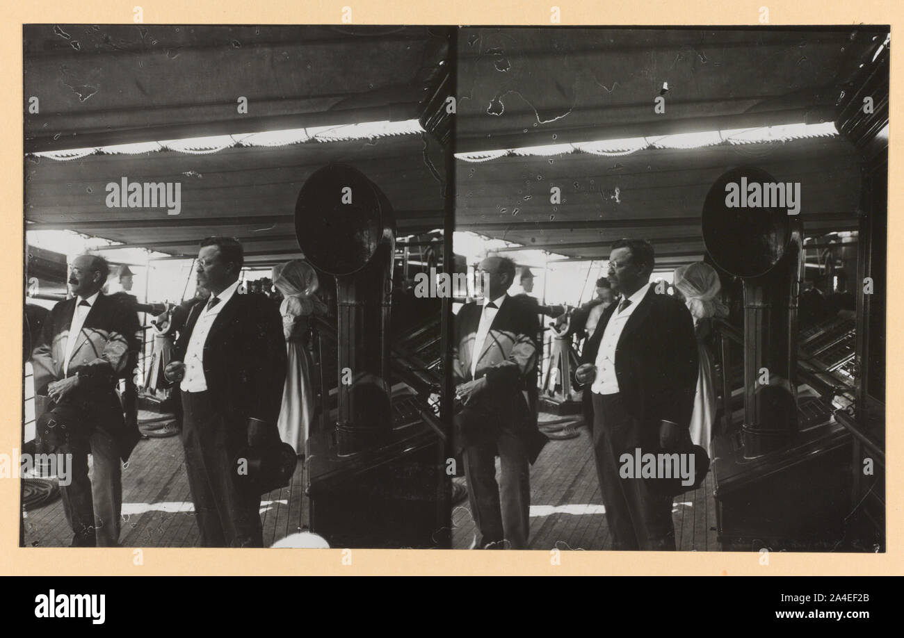 Theodore Roosevelt on deck of ship with another man, facing left Stock ...