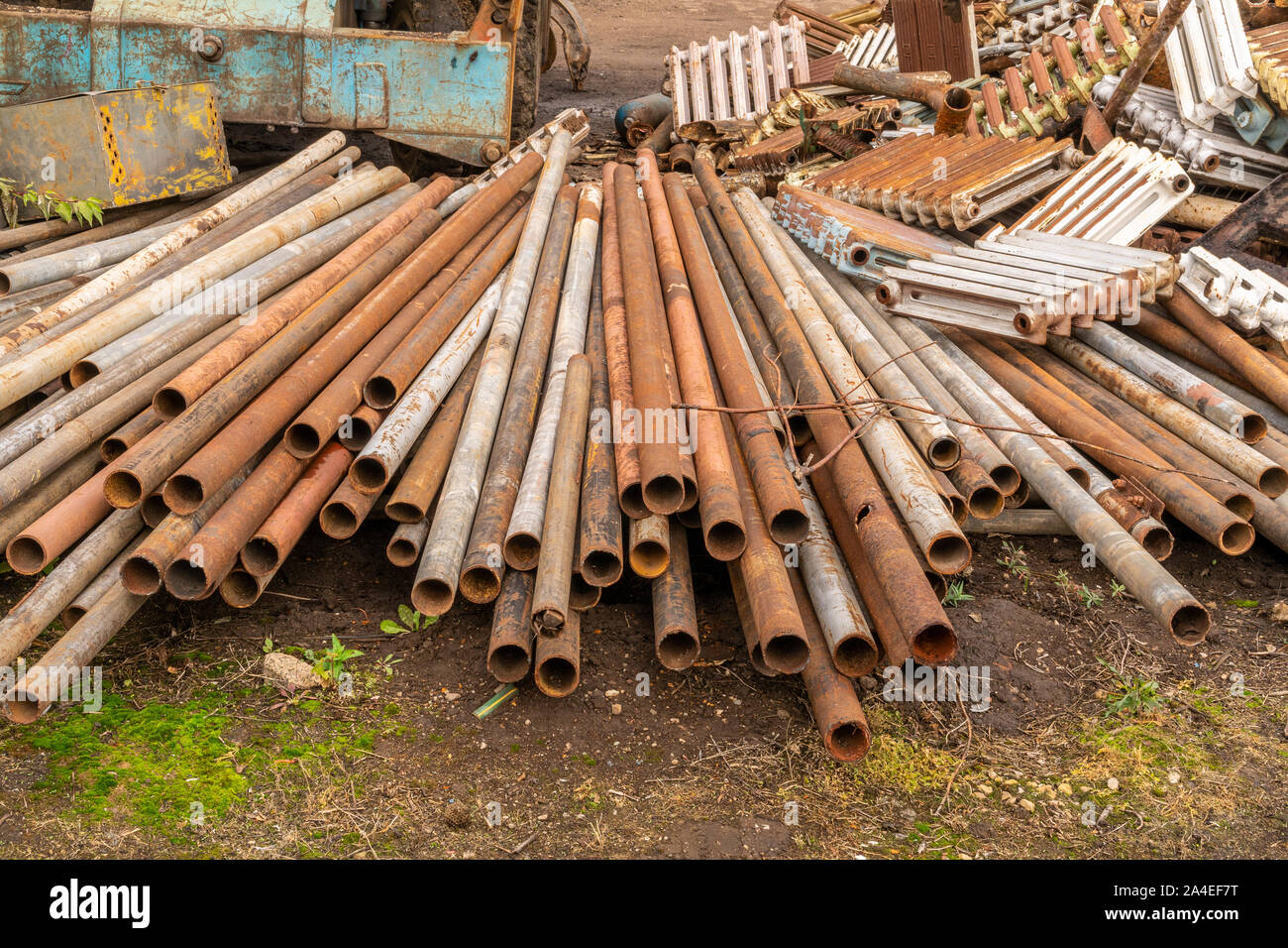 Scrap metal waste is stored in a recycling yard waiting to be melted ...