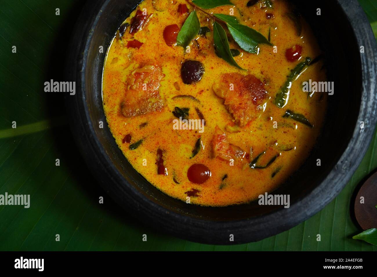 Fish Molly / Molee -Kerala style fish stew cooked in coconut milk Stock ...