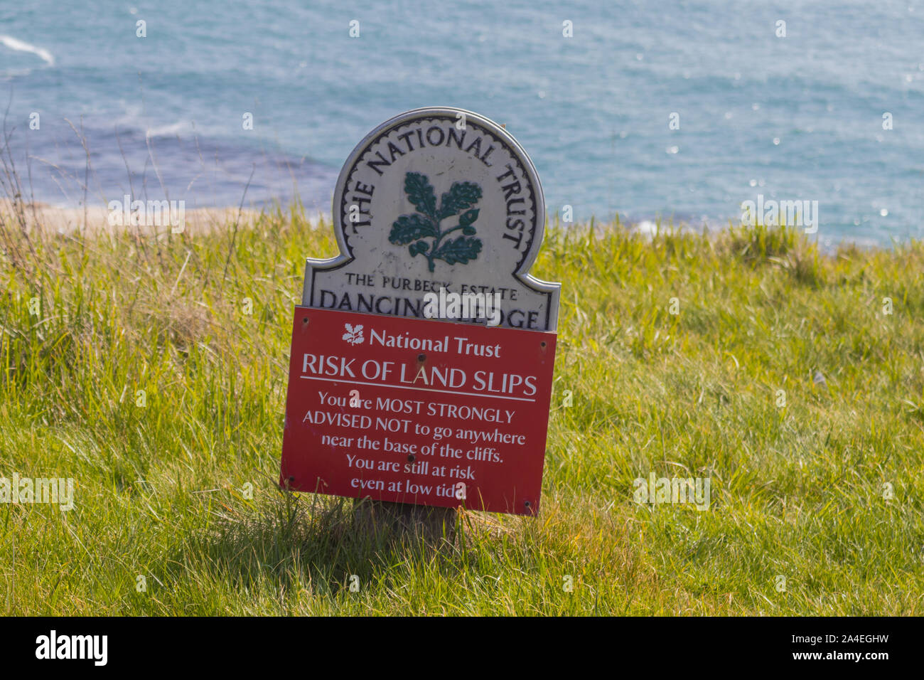 Cliff top warning sign at Dancing Ledge near Langton Matravers, Dorset ...