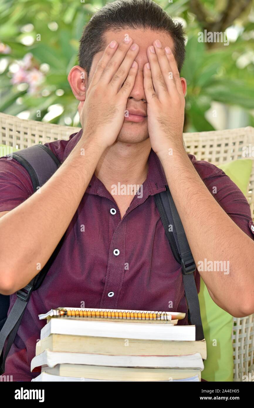 Shameful Young Student With Notebooks Stock Photo - Alamy
