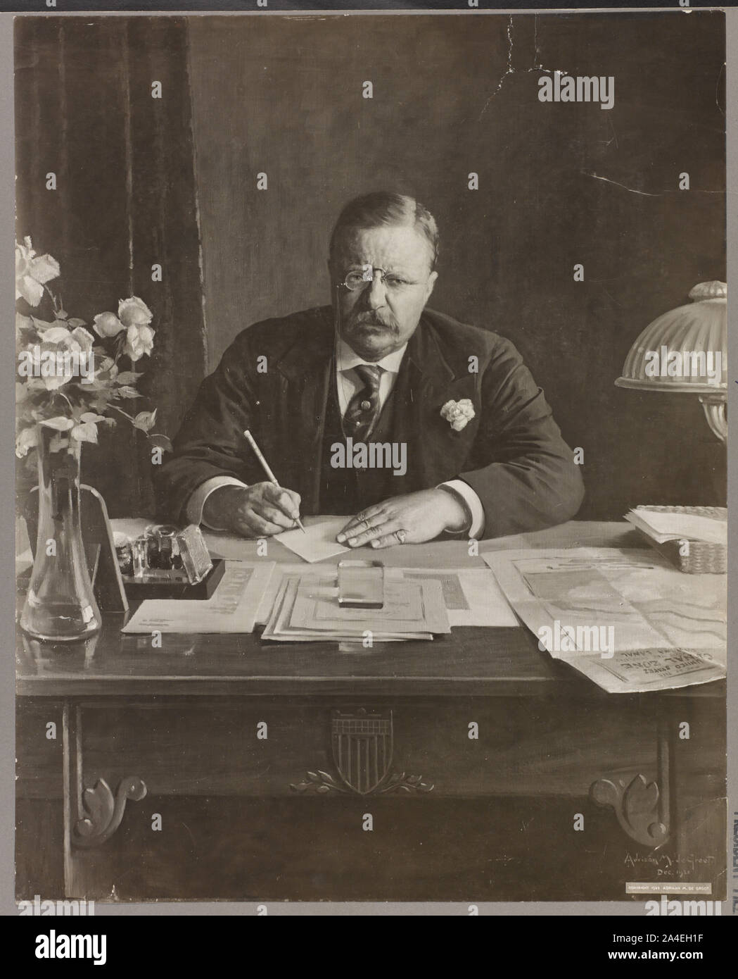 Theodore Roosevelt, half-length portrait, seated at desk, facing front ...