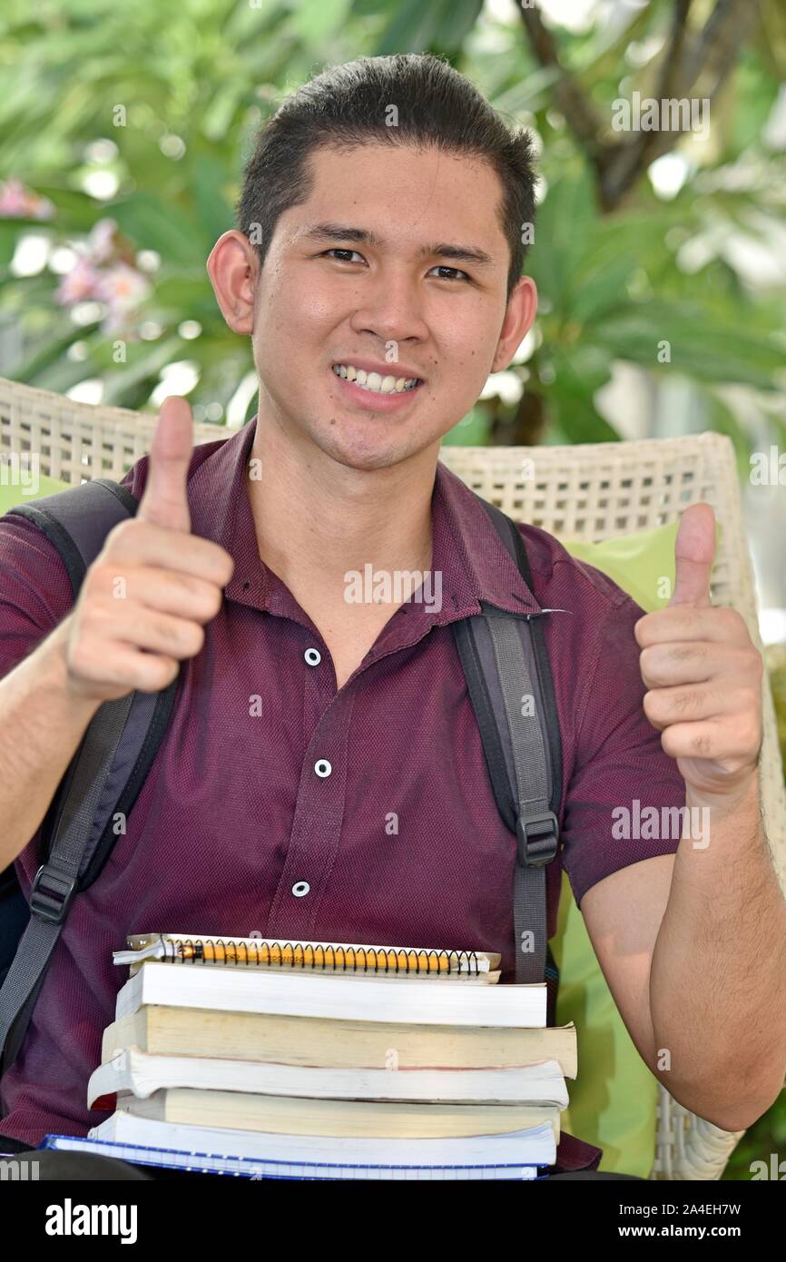 Boy Student With Thumbs Up Stock Photo - Alamy