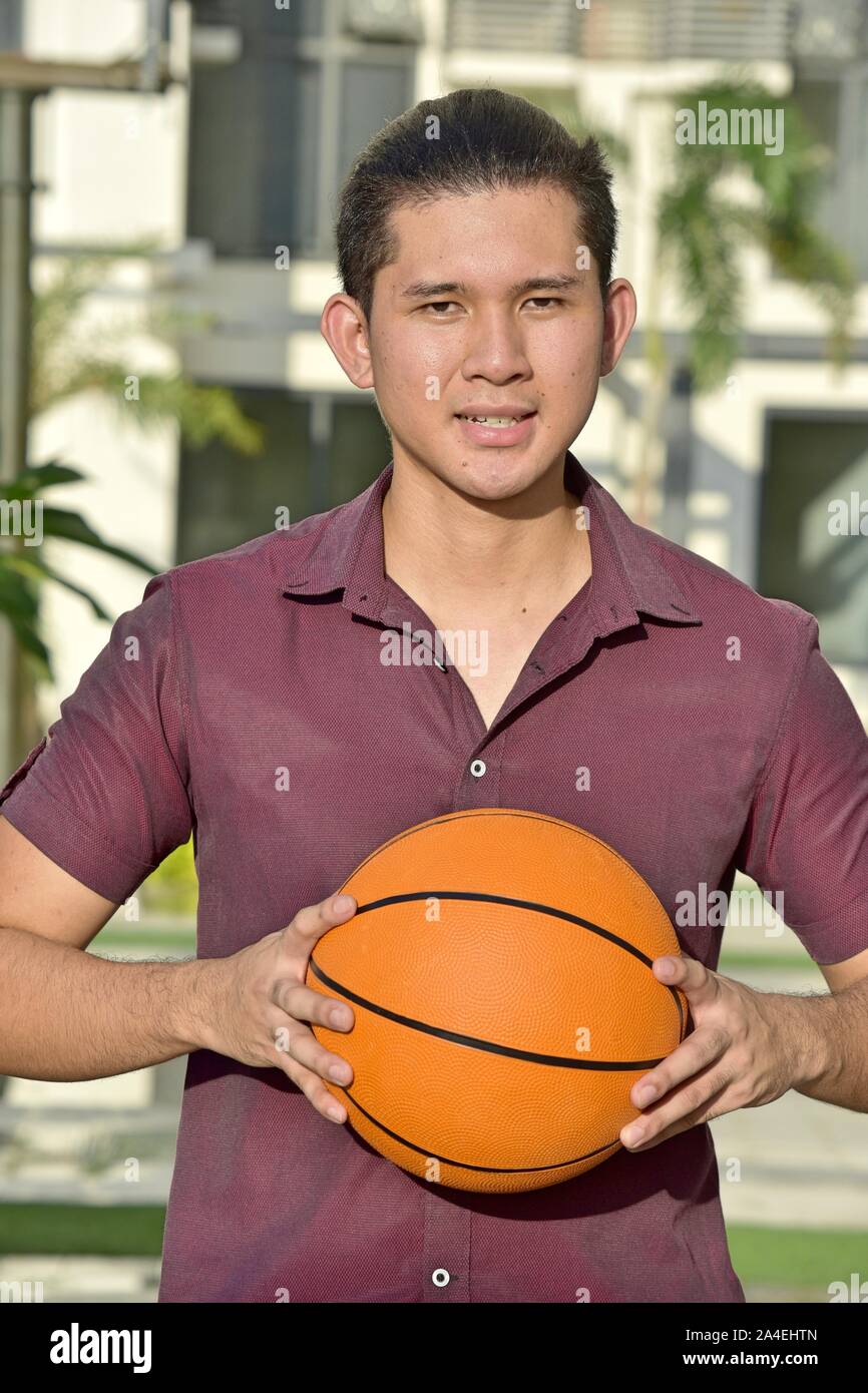Athletic Filipino Male Basketball Player Smiling With Basketball Stock ...