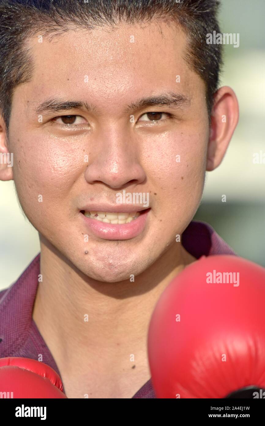 Asian Male Boxer Smiling Wearing Boxing Gloves Stock Photo - Alamy