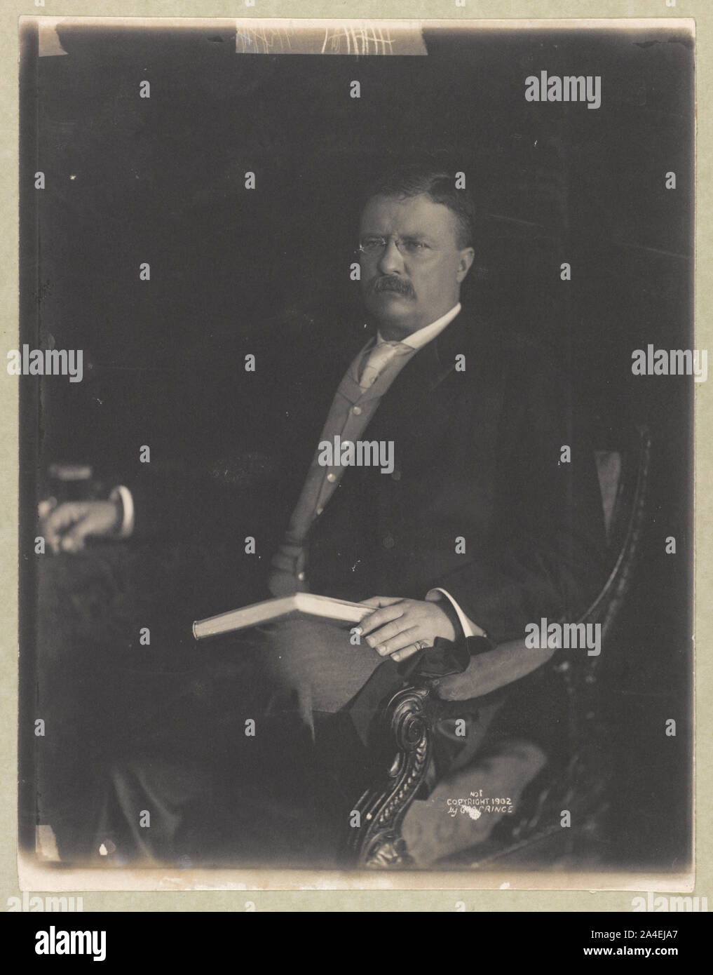 Theodore Roosevelt, three-quarter length portrait, seated, facing left ...