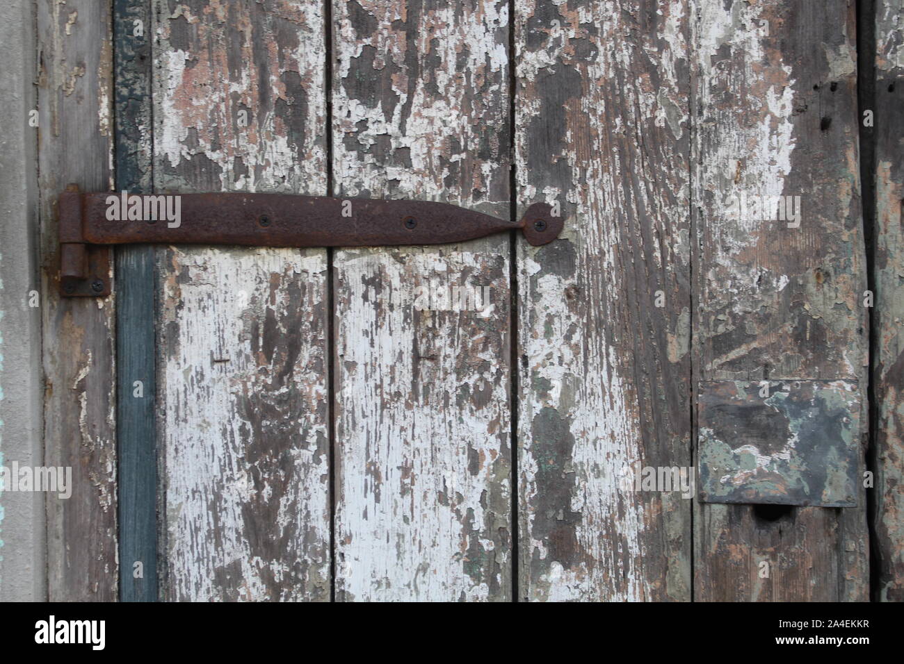 weathered door with rusted hinges Stock Photo - Alamy