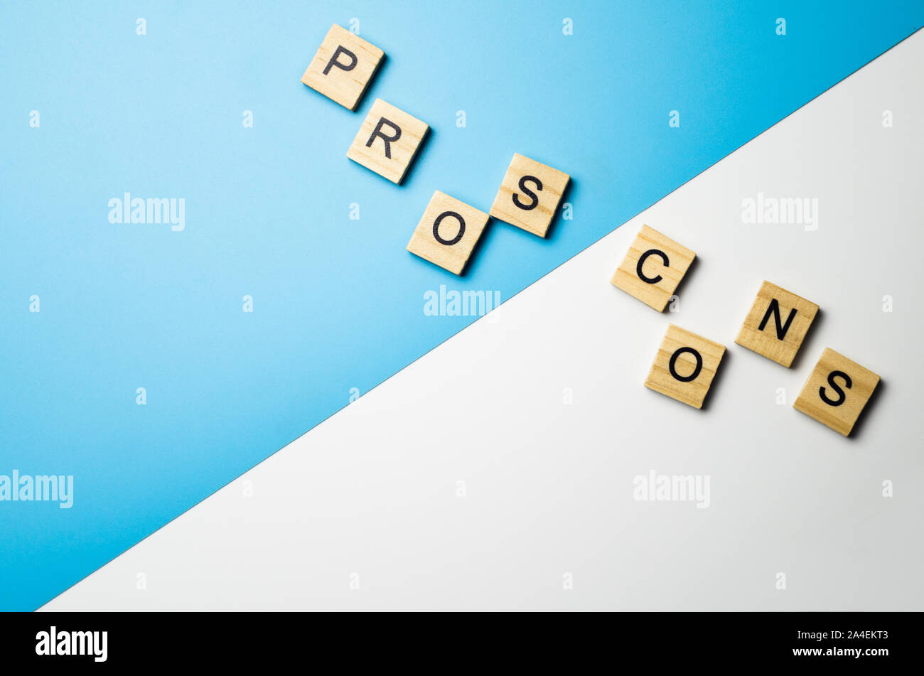 "Pros and Cons" word in the wooden block on duo color background Stock ...